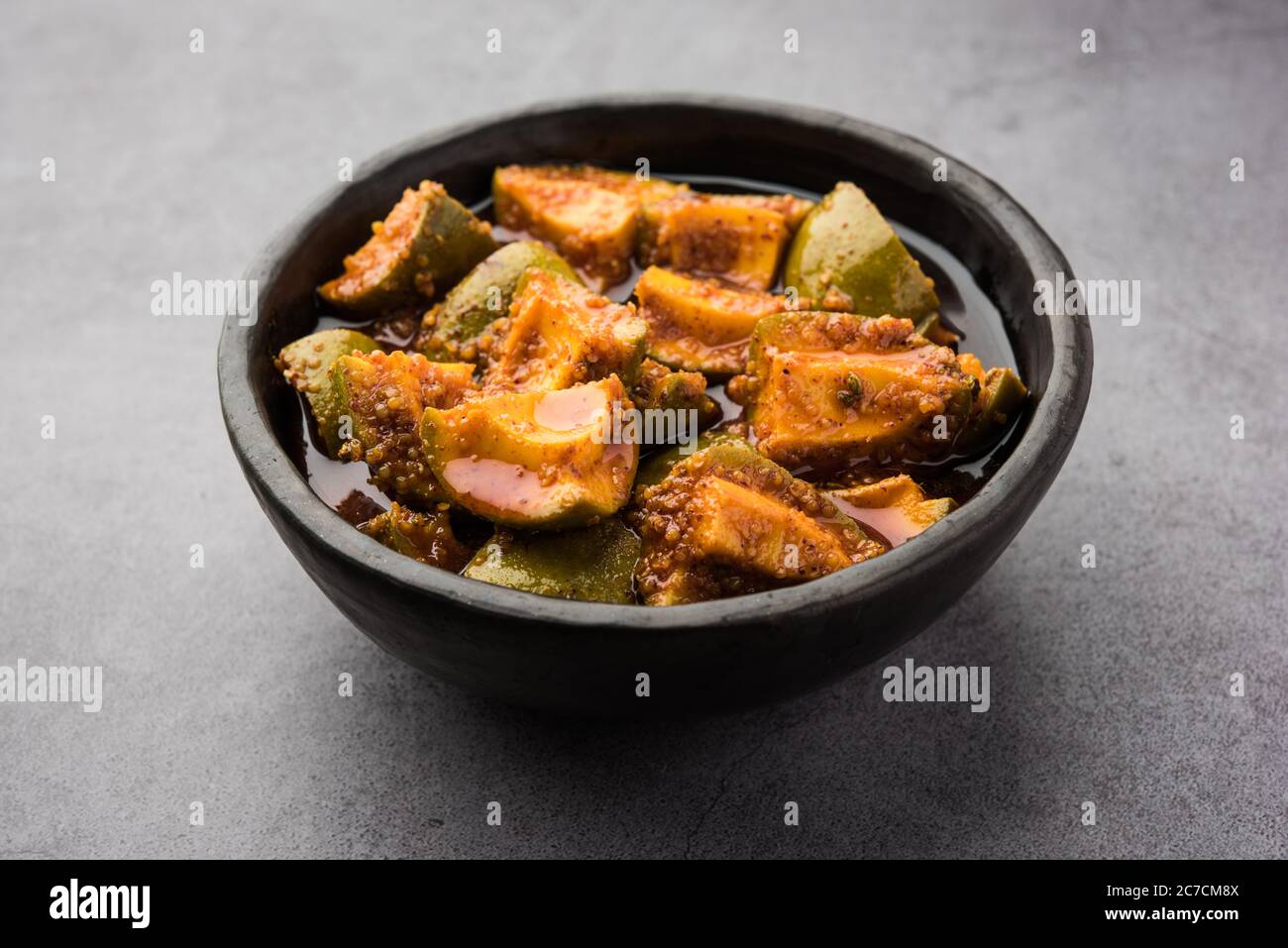 Homemade Mango Pickle or Aam ka Achar in a bowl, selective focus Stock ...
