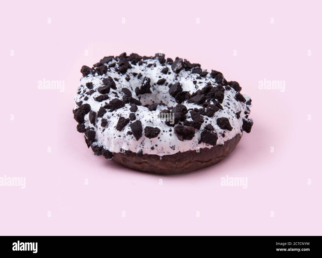 donut in dark chocolate glaze with pieces of chocolate Stock Photo - Alamy