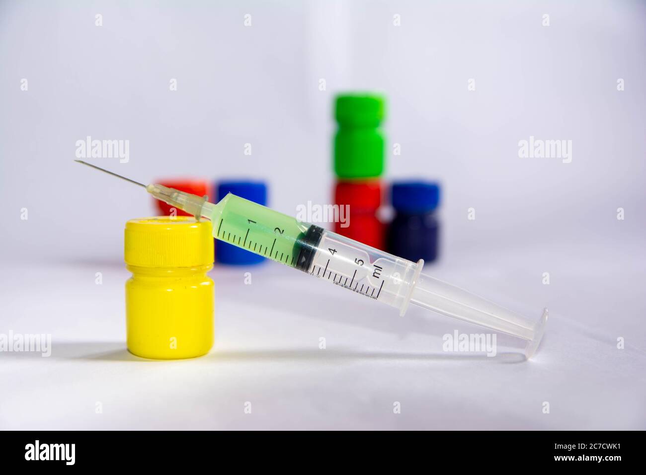 Medical syringe with green liquid isolated on white background Stock ...