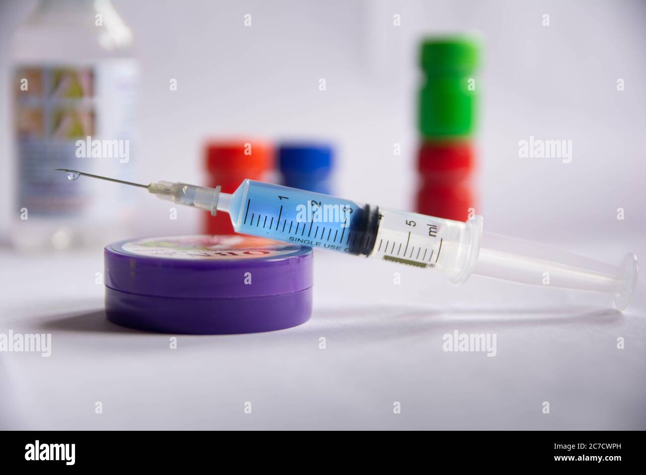 Medical syringe with blue liquid isolated on white background Stock ...