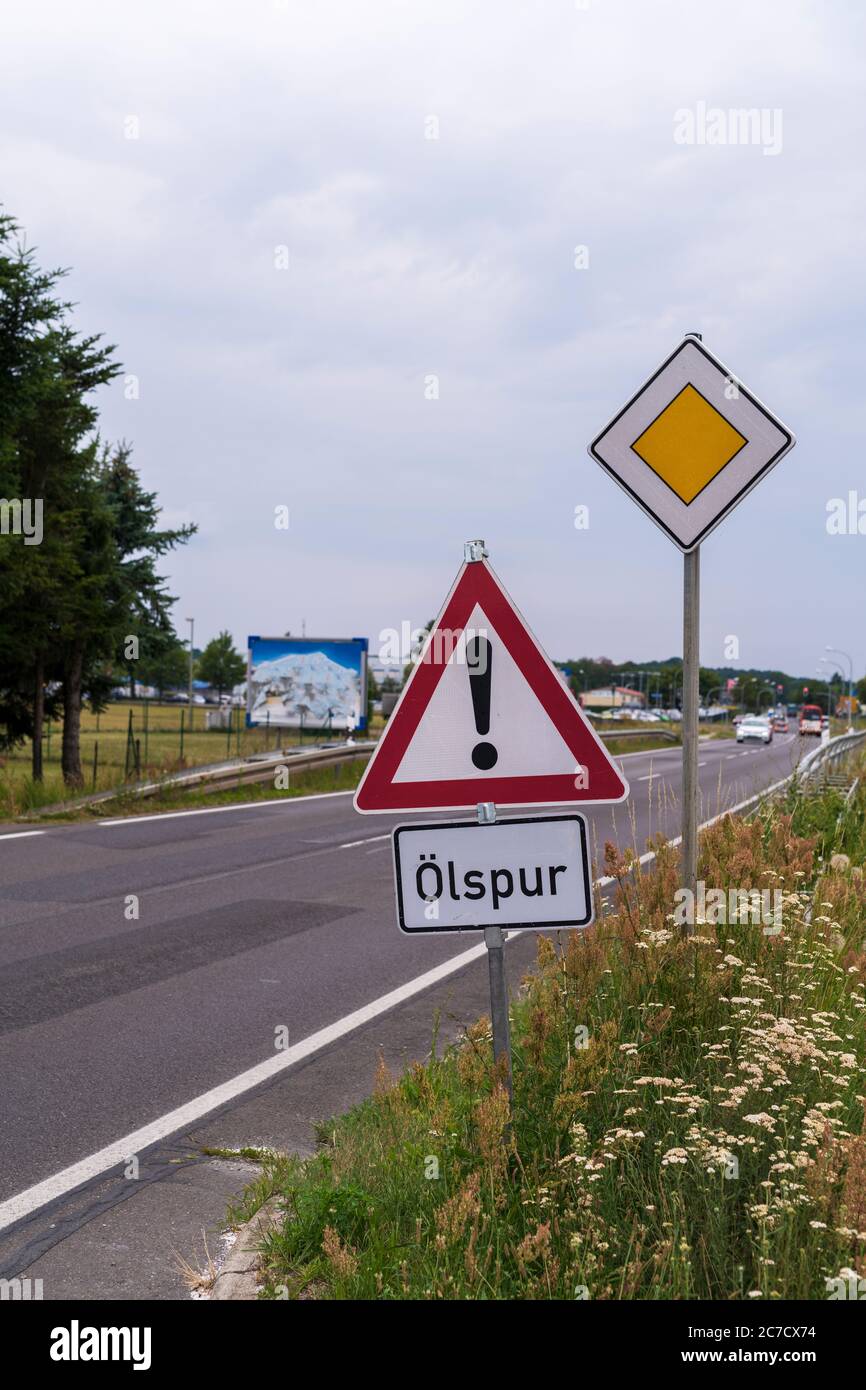 A warning sign with the addition of a trace of oil Stock Photo - Alamy