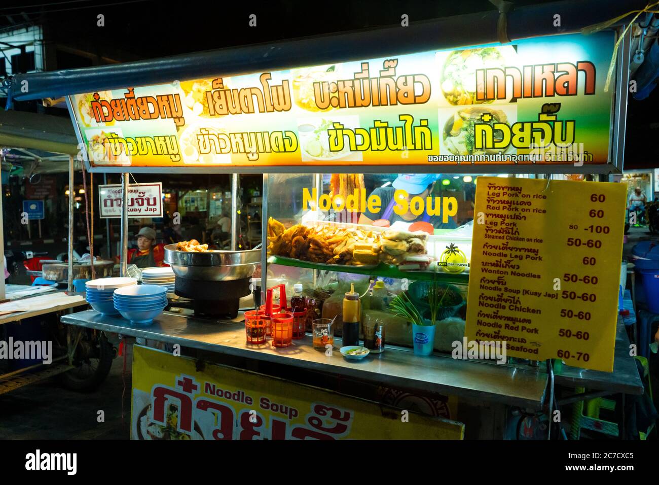 Asian street food night market. Mobile food counter carts Stock Photo ...