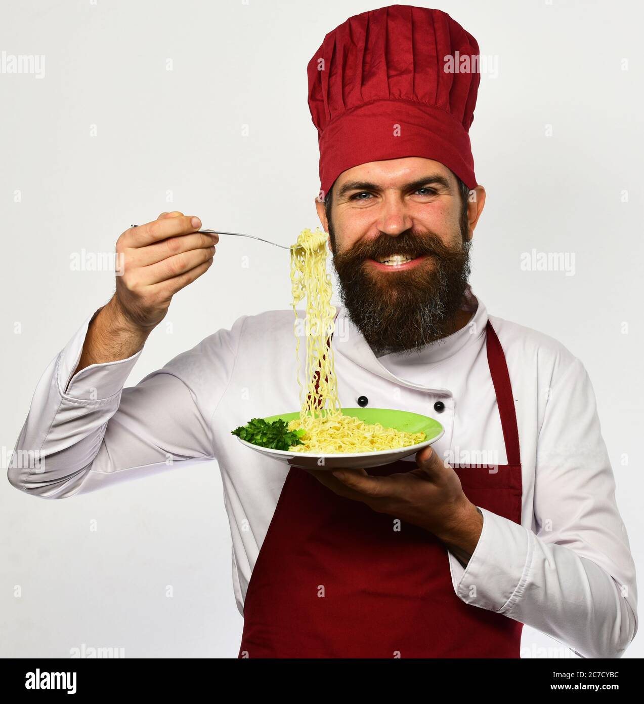 Traditional menu concept. Cook with smiling face in burgundy uniform ...