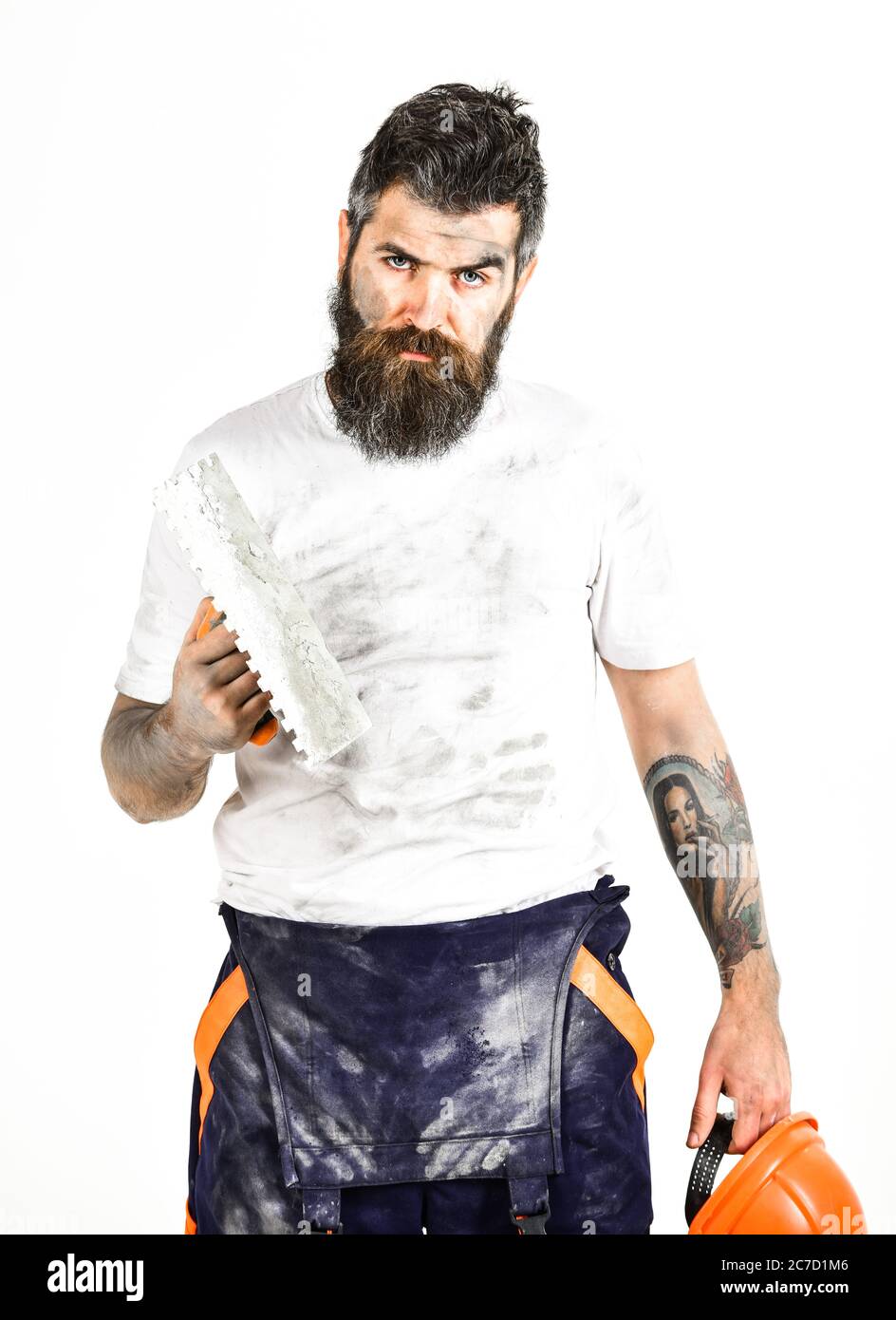 Brutal repairman concept. Painter, plasterer, repairman, foreman holds ...