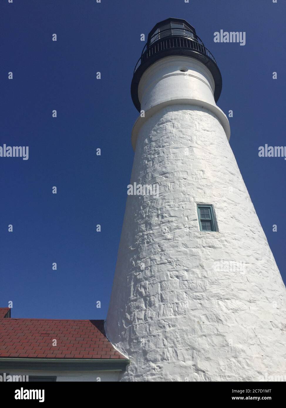 Vertical low angle shot of a lighthouse with a clear sky in the ...