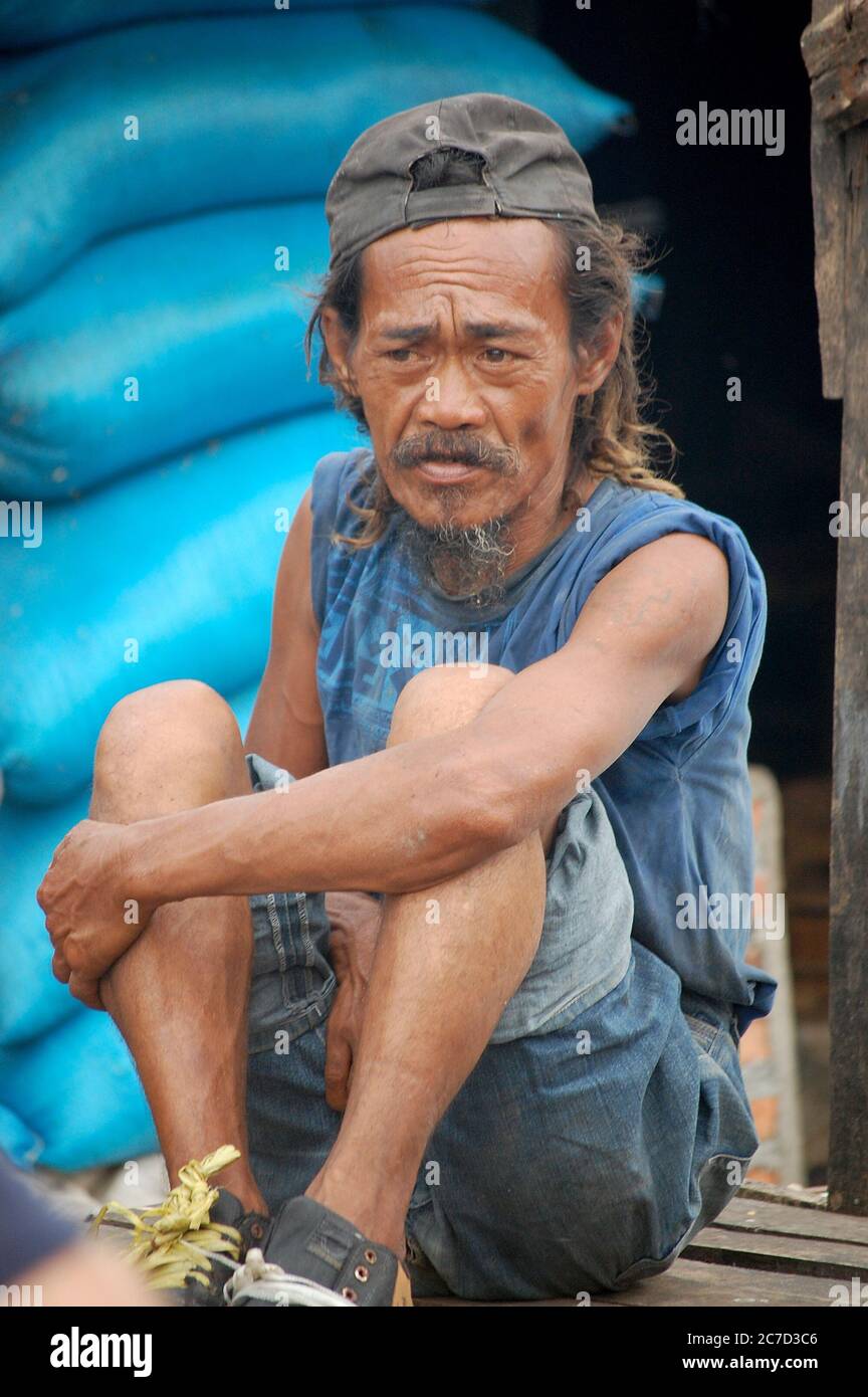 JAKARTA, INDONESIA - Mar 07, 2014: old man close up in market place ...