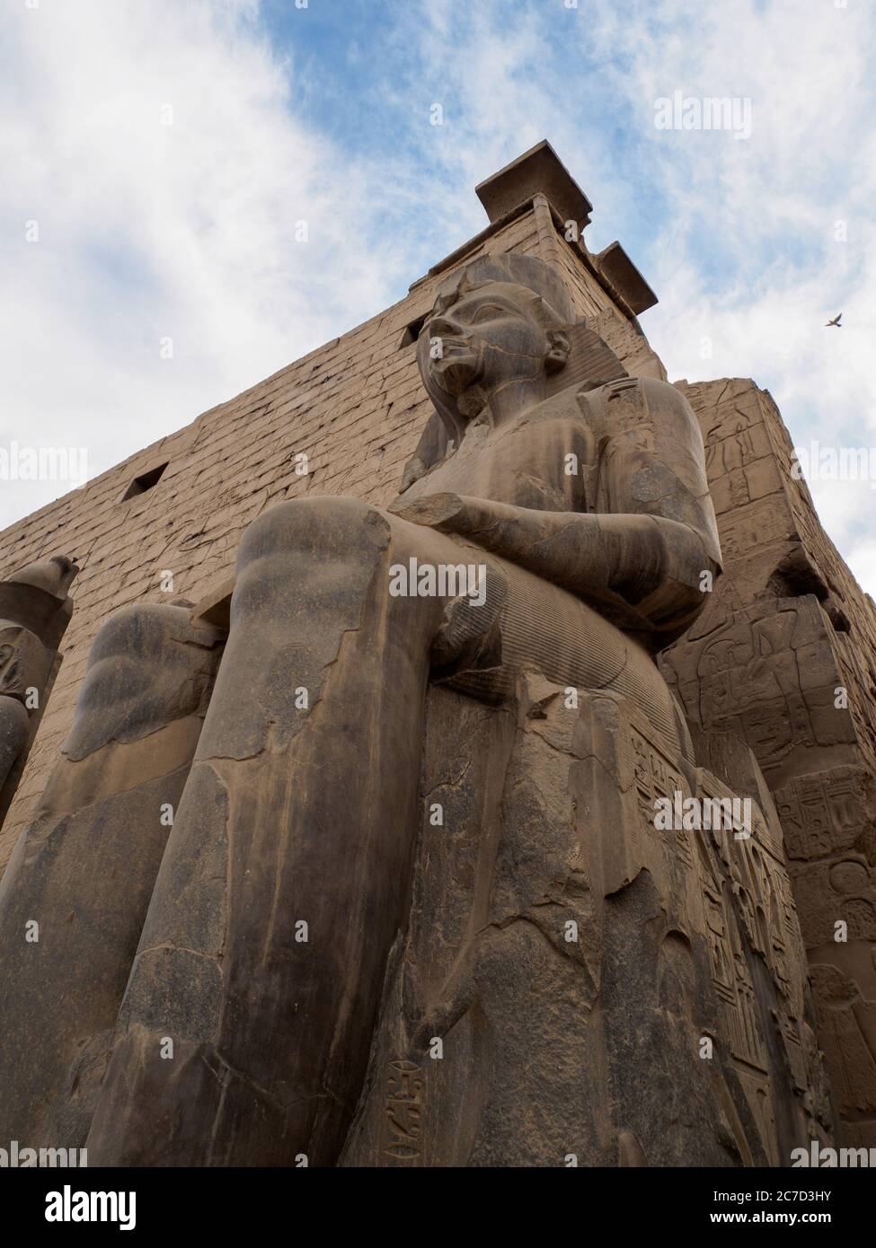 the huge statue of pharao ramses ii watches the entrance of luxor ...