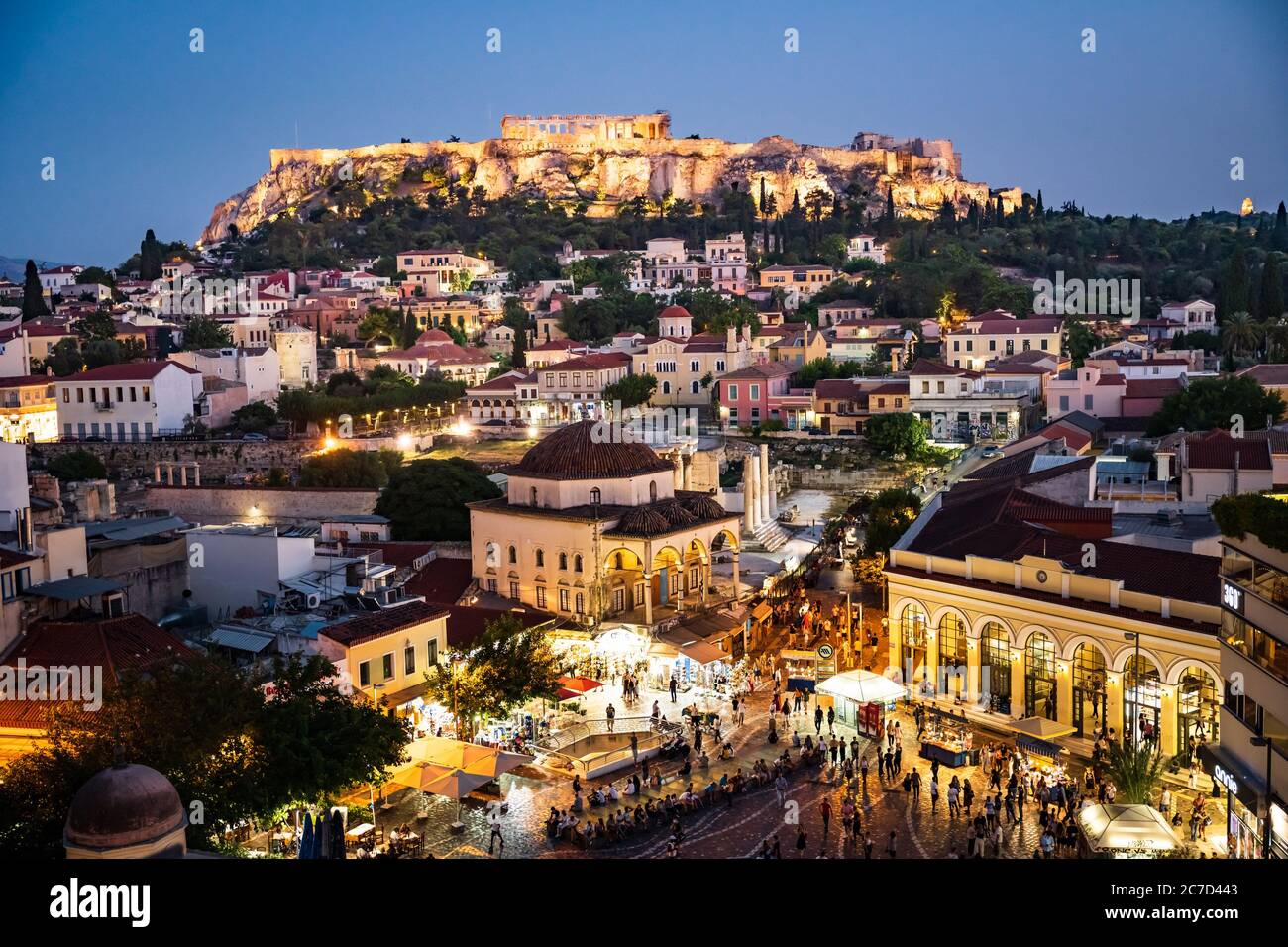 The historical Acropolis in Athens Greece is enthroned above the lively ...