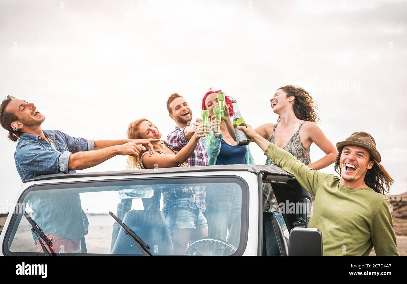 Group of happy friends making party on convertible car - Millennial ...