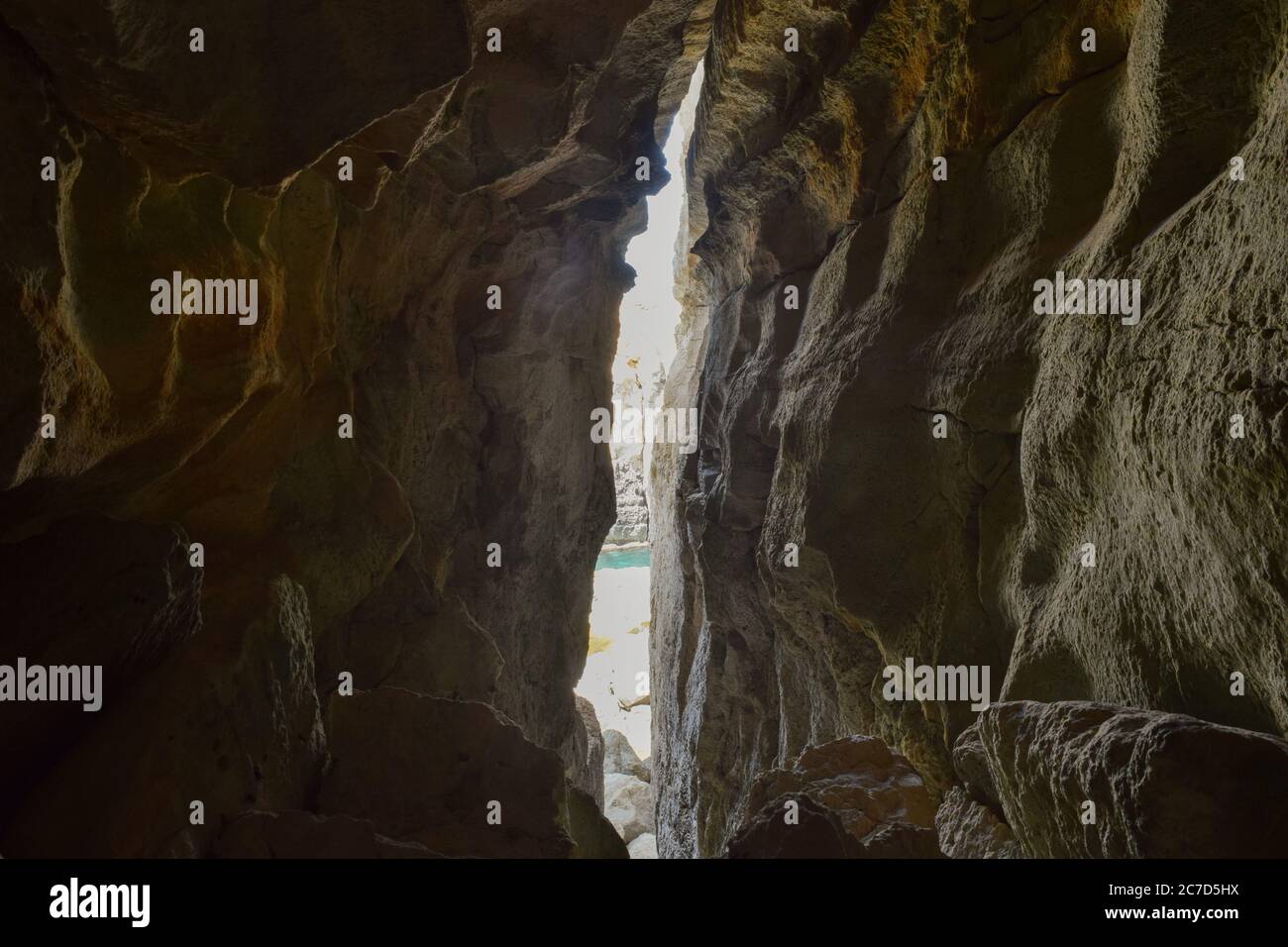 Beautiful shot of a crack in a rocky cave at the sea Stock Photo - Alamy