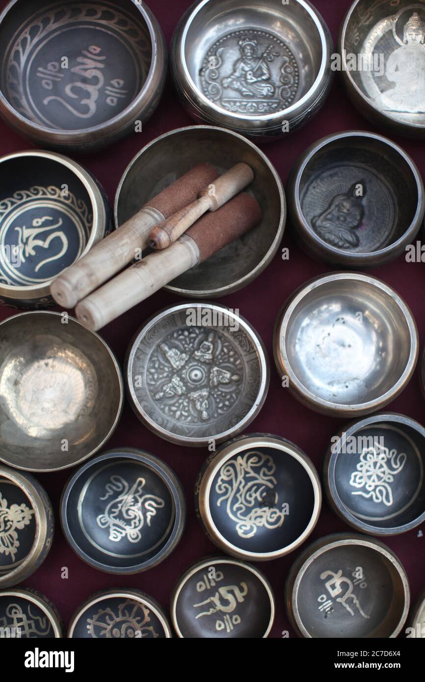 Vertical overhead shot of traditional metal pots in India, with pestles ...