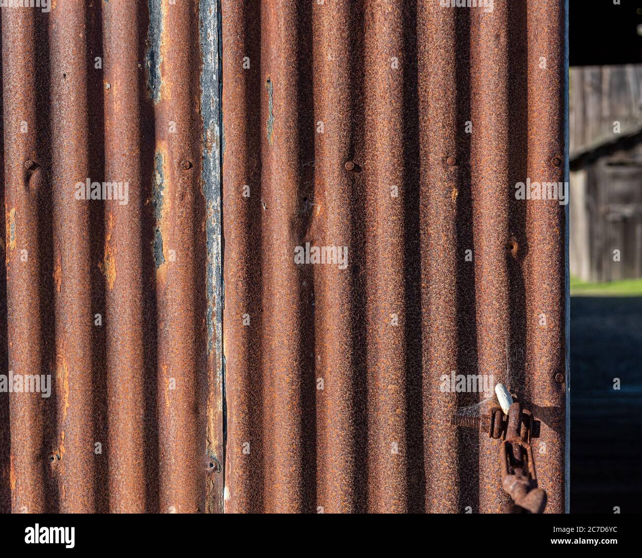 Rusty metal door with corrugated, wavy pattern, background and texture ...