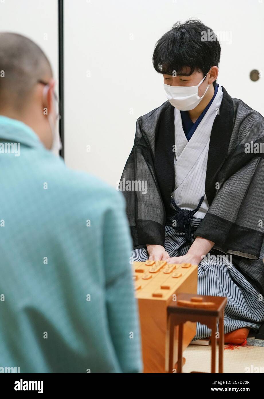 Japan's 17-year-old shogi sensation Sota Fujii (R) is pictured after ...