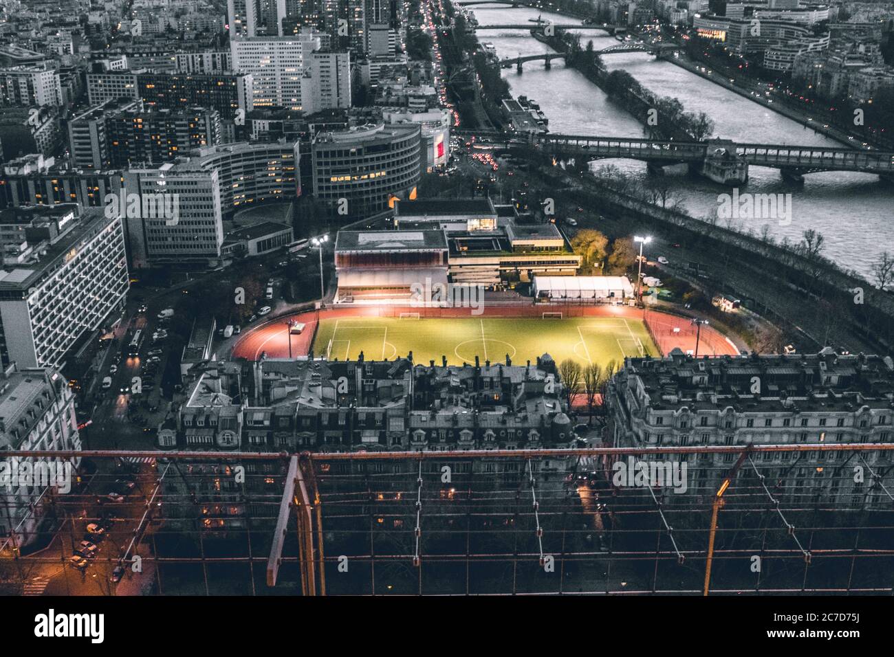 Bird's-eye shot of a football stadium in color and the rest of the city ...