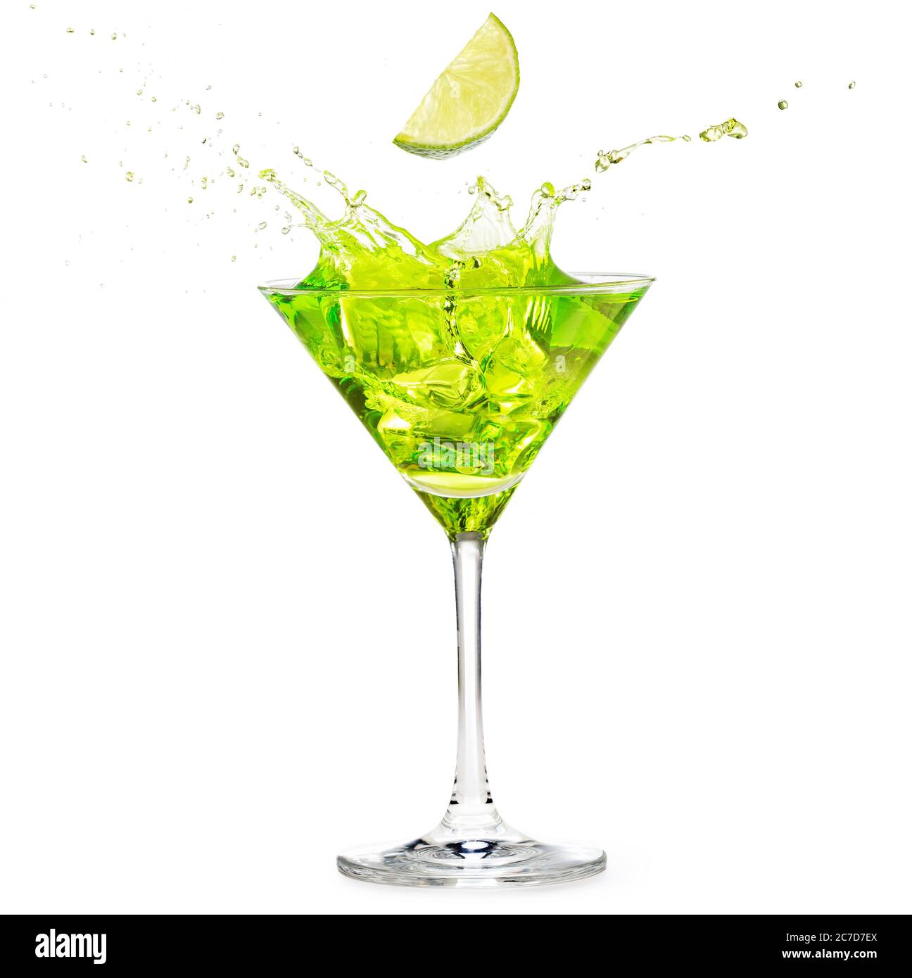 lime slice falling into splashing green cocktail isolated on white ...