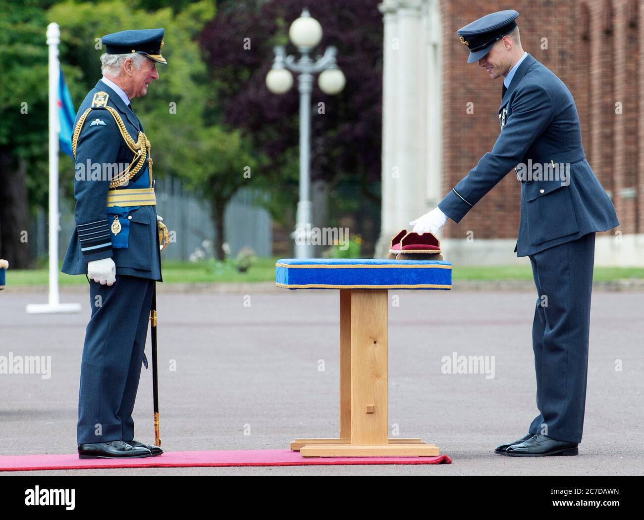 Flying Officer Benjamin Galvin takes his Queen's Medal from the Prince ...