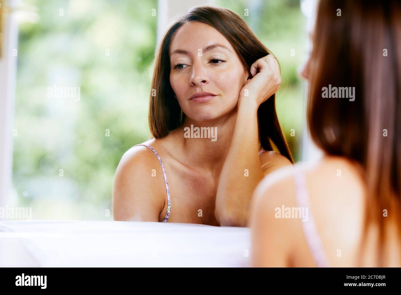 Girl looking thoughtful Stock Photo - Alamy