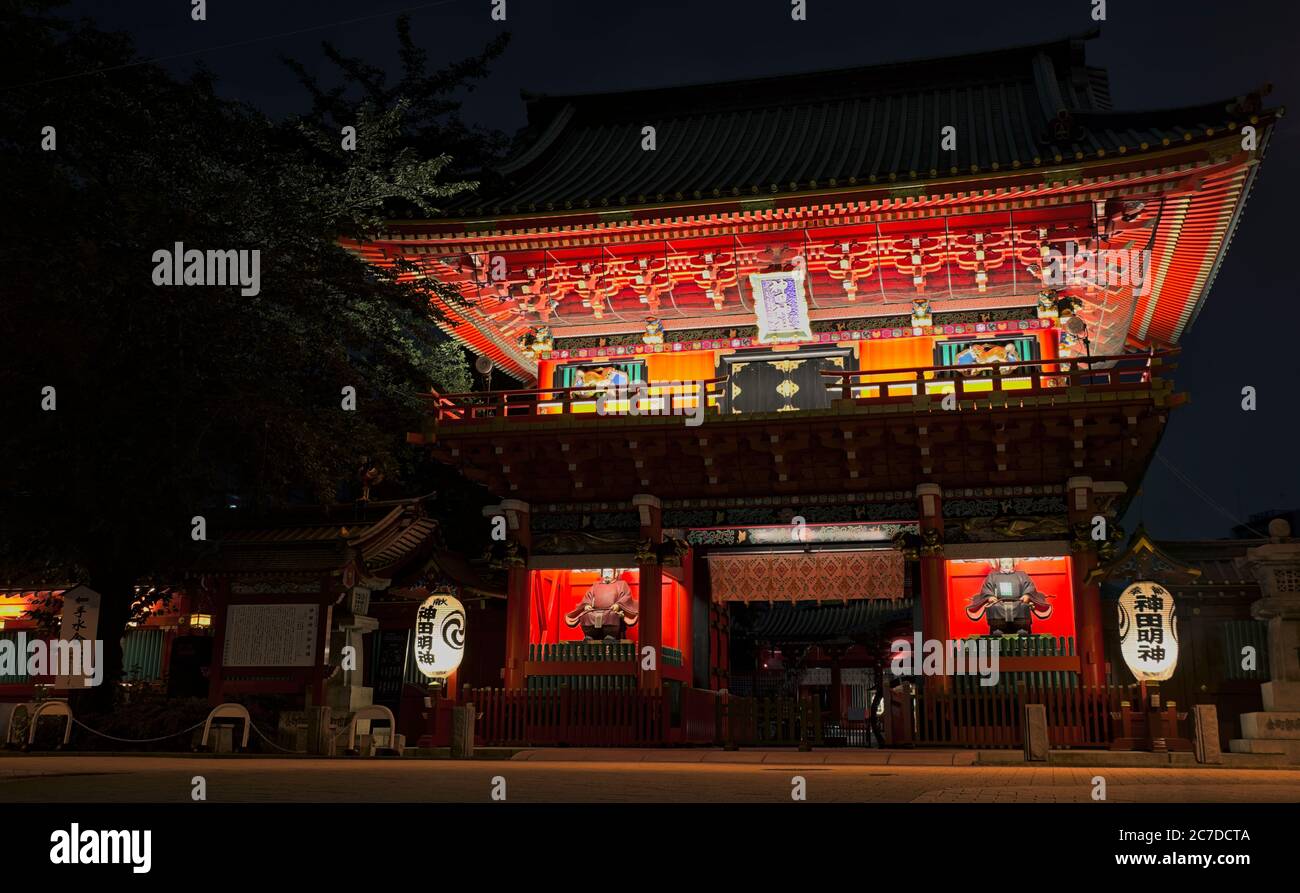 Night view just outside of the bright red gate of Kanda-myojin Shrine ...