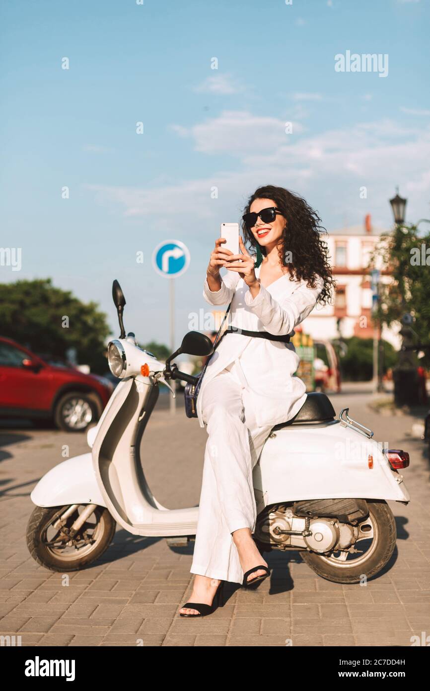 Girl moped red hi-res stock photography and images - Alamy