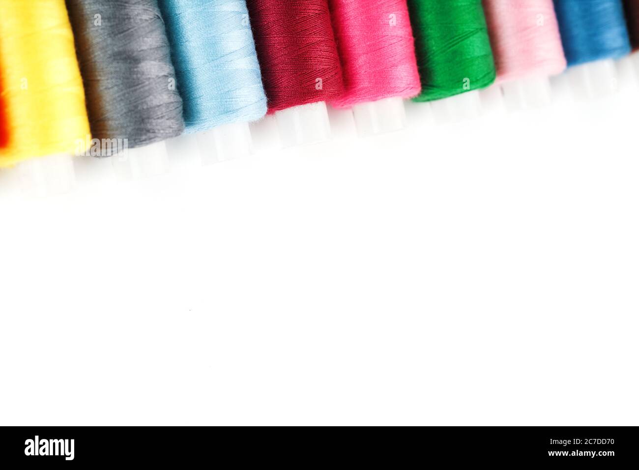 Colorful cotton craft sewing threads multicolored in a row isolated on ...