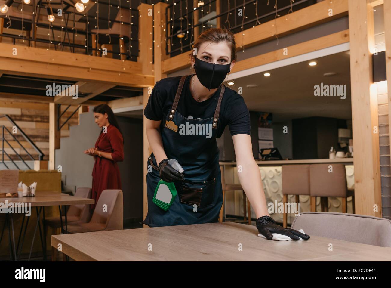 Person cleaning tables hi-res stock photography and images - Alamy