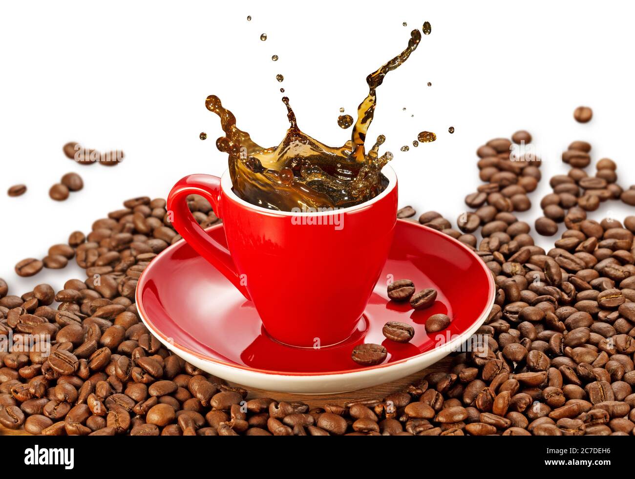 coffee splashing in a red cup on coffee beans Stock Photo - Alamy