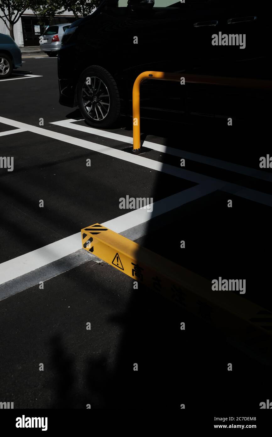 MATSUYAMA, JAPAN - Sep 23, 2019: A vertical closeup shot of a black car ...