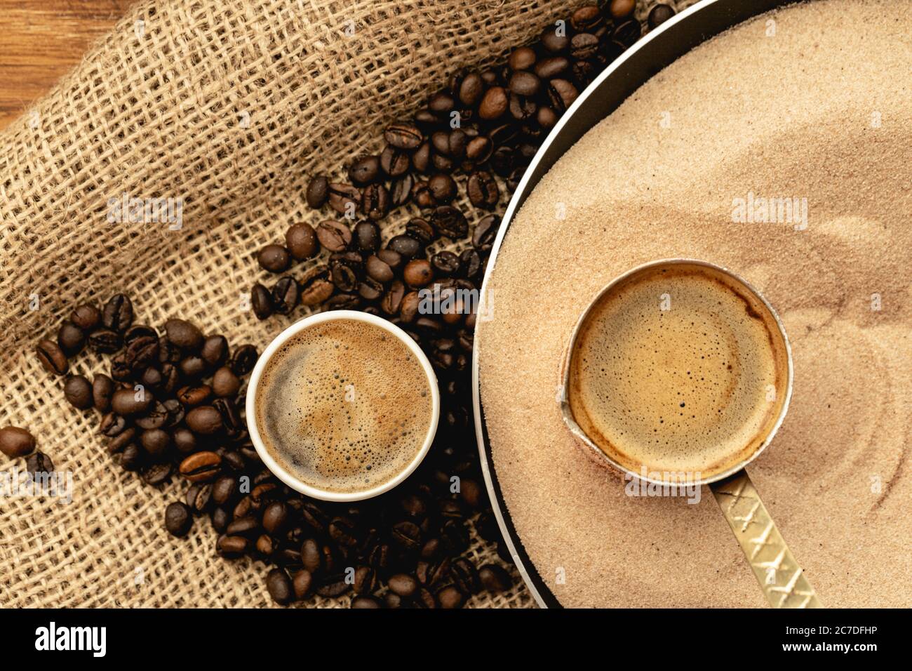 Turkish coffee prepared in sand with turk Stock Photo - Alamy