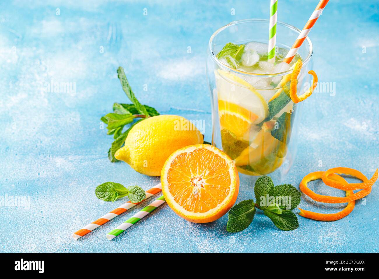 Summer refreshing cocktails, lemonade or mojito with lemon, orange and ...