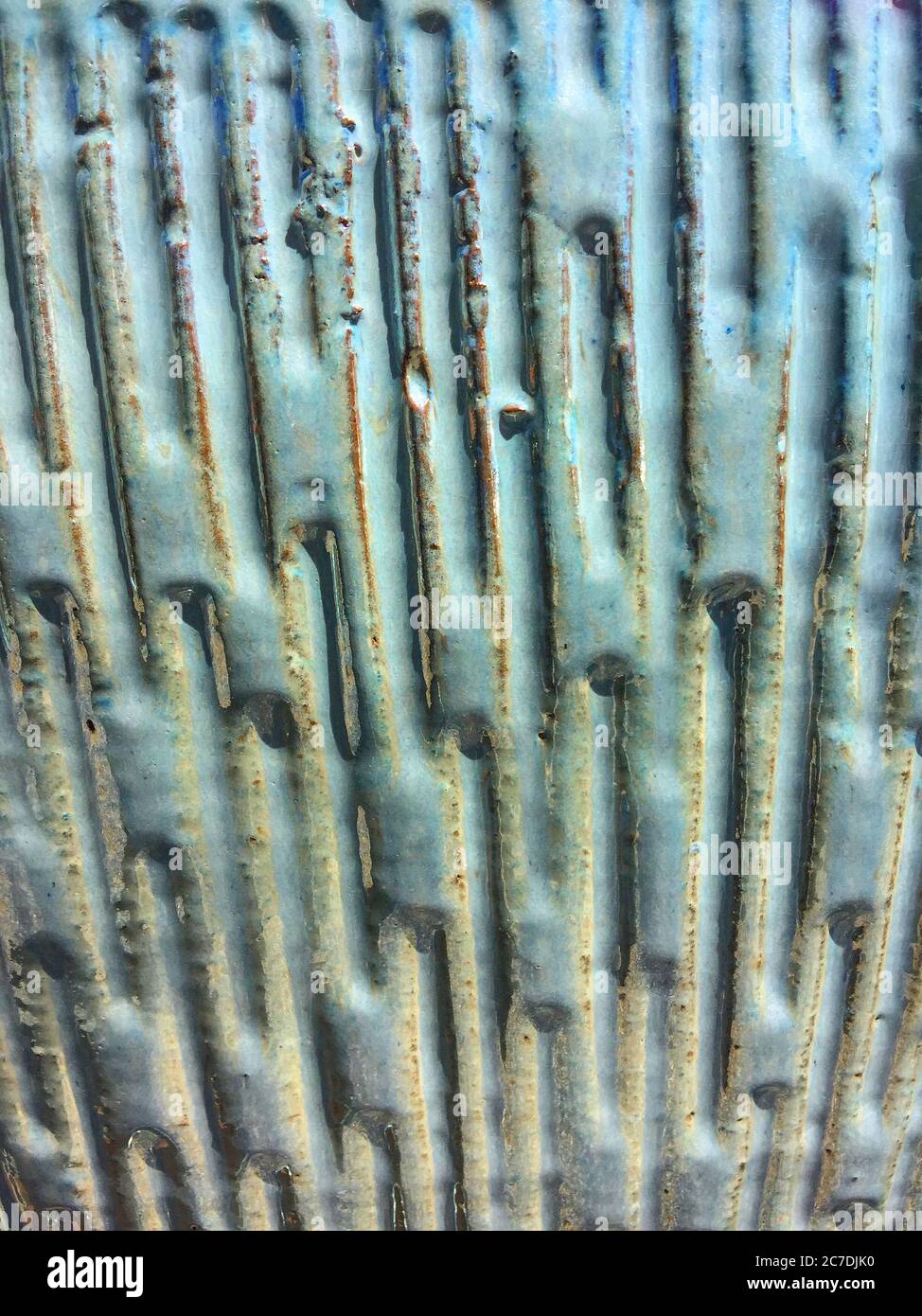 Macro photo of a clay pot with an aqua patina and linear pattern Stock ...