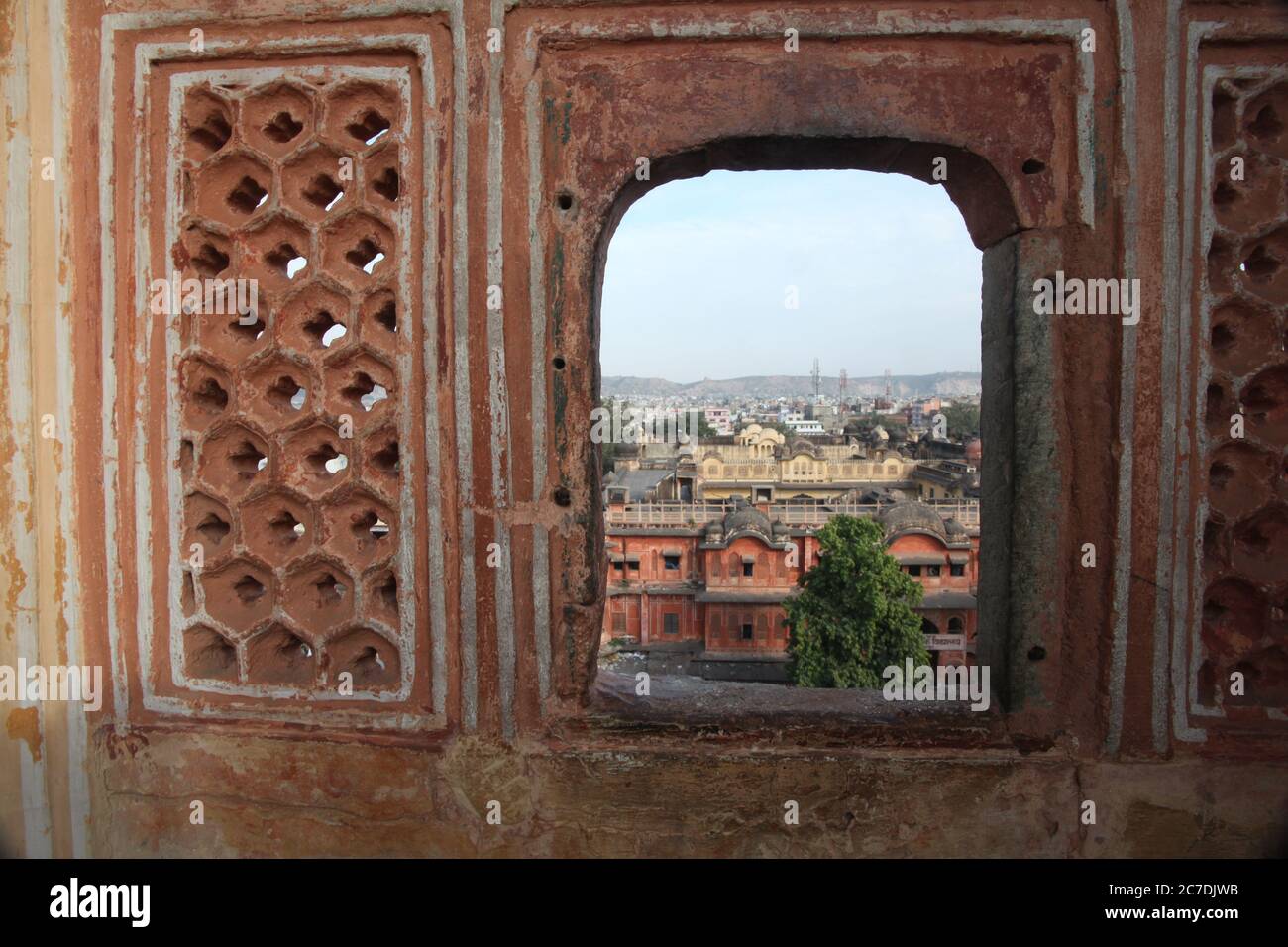Horizontal shot of an arch and a lot of colorful buildings in India ...