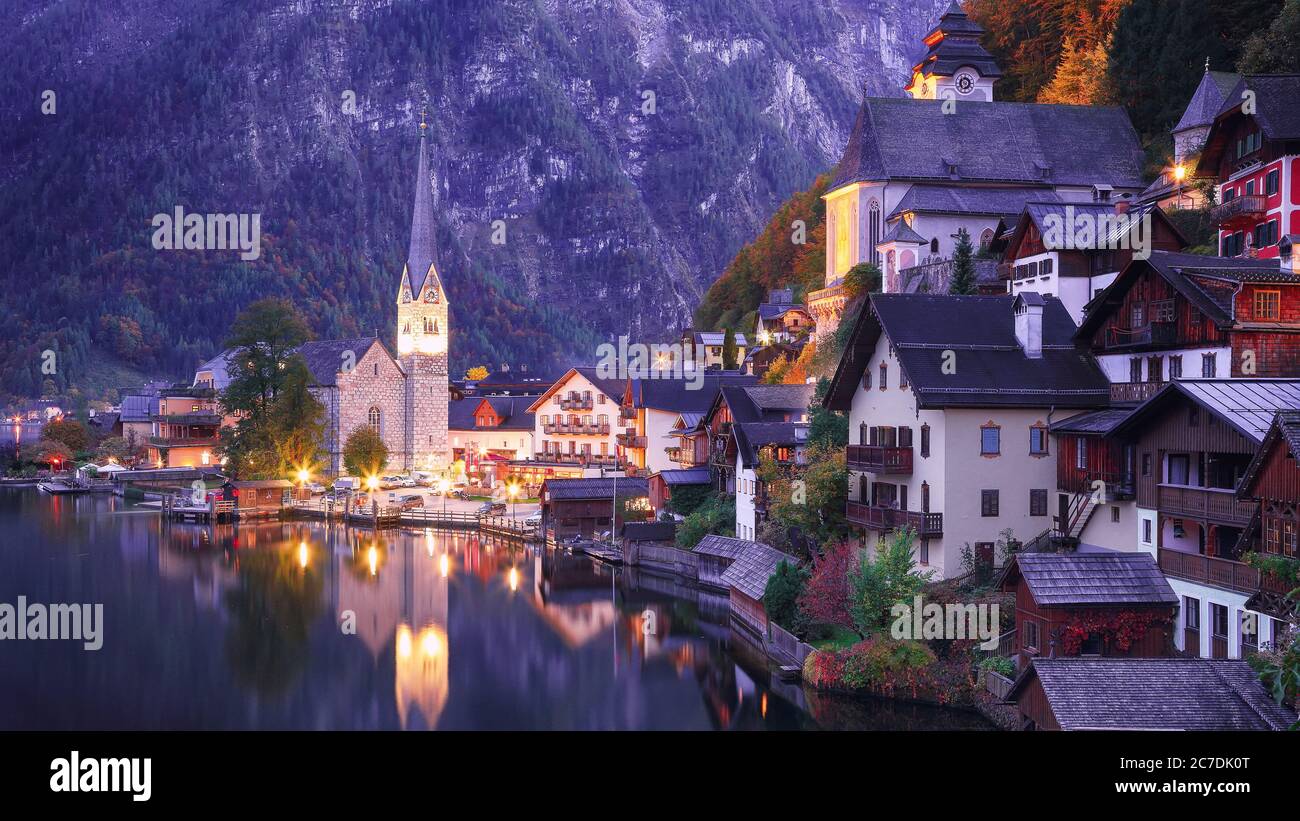 Autumnal sunset of famous Hallstatt lakeside town reflecting in ...
