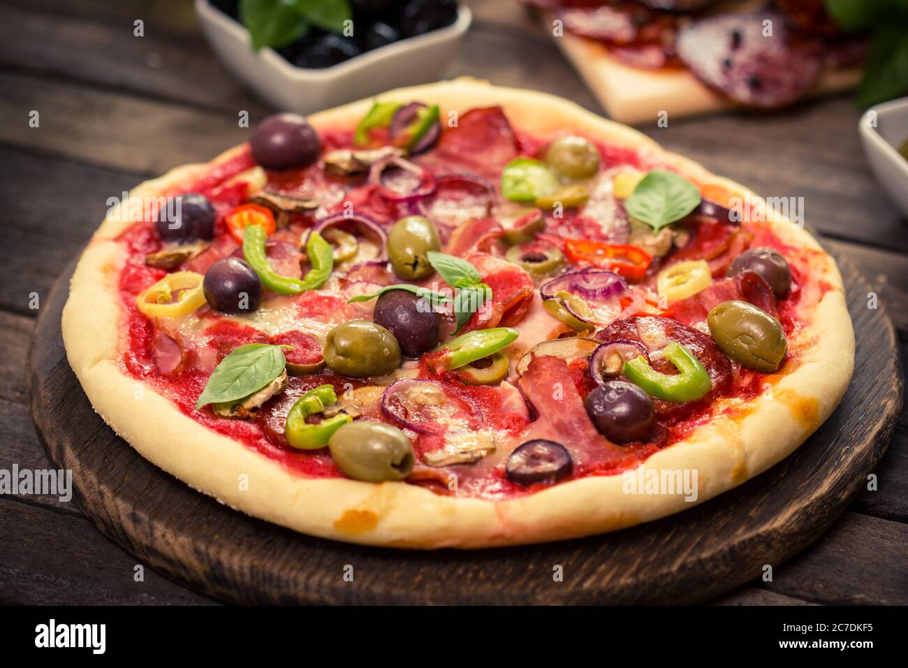 Homemade pizza with ham, cheese and vegetables Stock Photo - Alamy