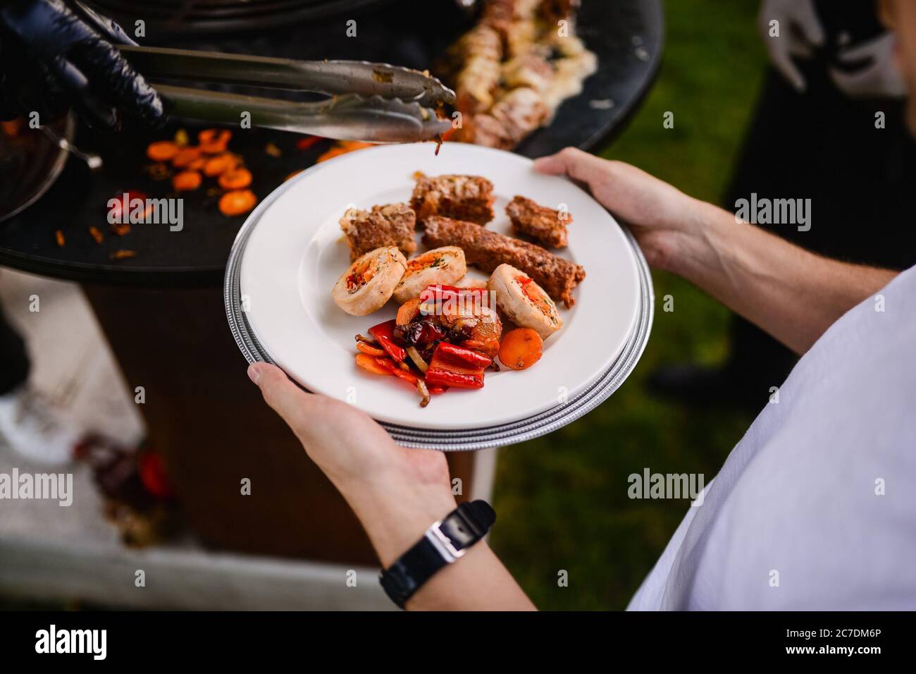 Cooking chef serves meat vegetables hi-res stock photography and images ...