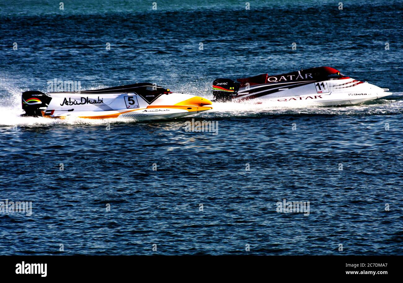 Water jets swimming in the blue water in Abu Dhabi Stock Photo - Alamy