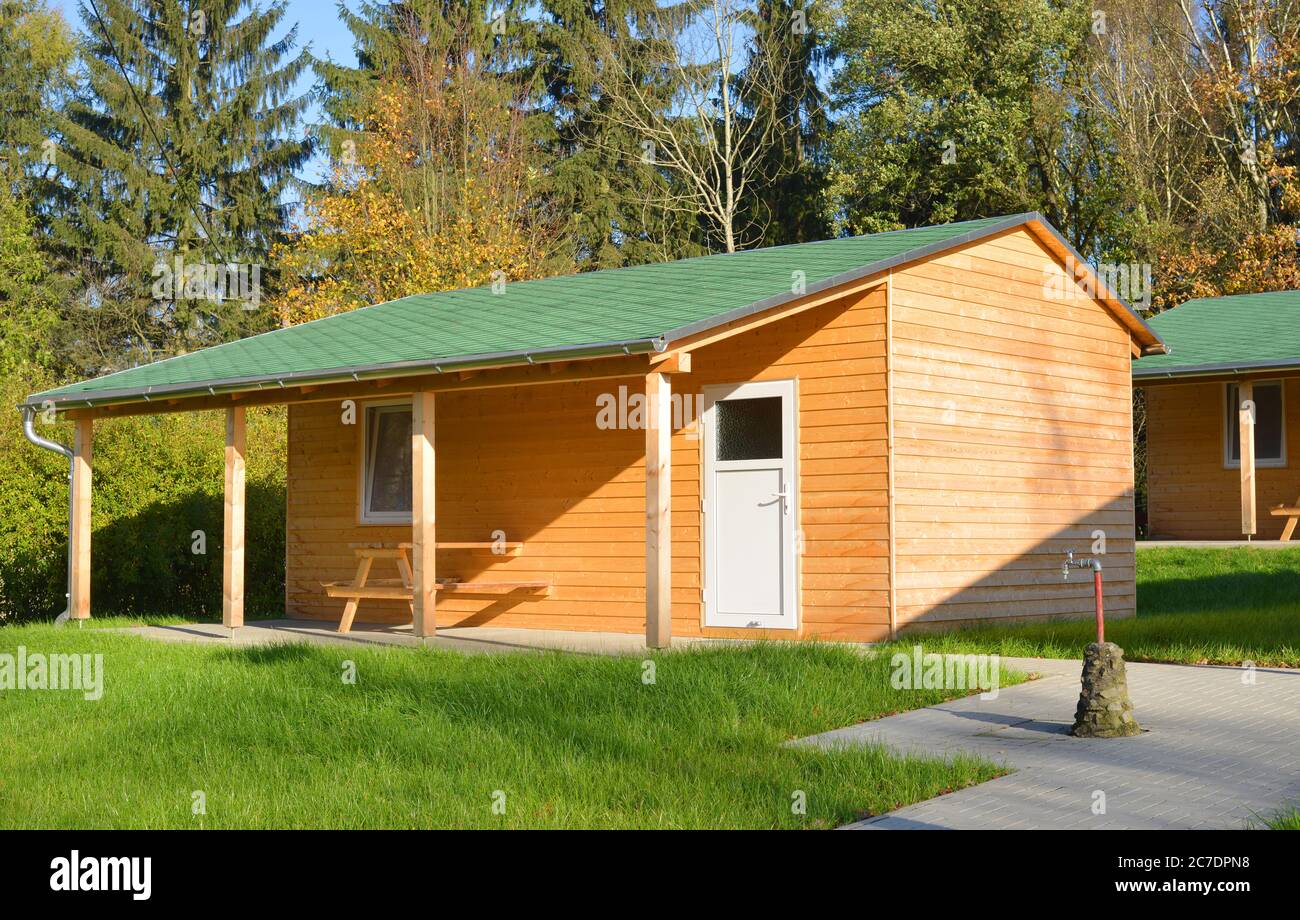 Wooden cabins at a camping site in the nature Stock Photo - Alamy