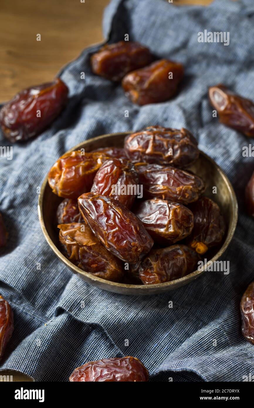 Organic Dry Red Dates in a Bowl Stock Photo - Alamy