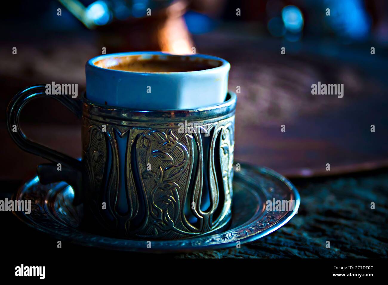 Traditional turkish coffee. It is cooking in hot sand. Turkiye Stock ...