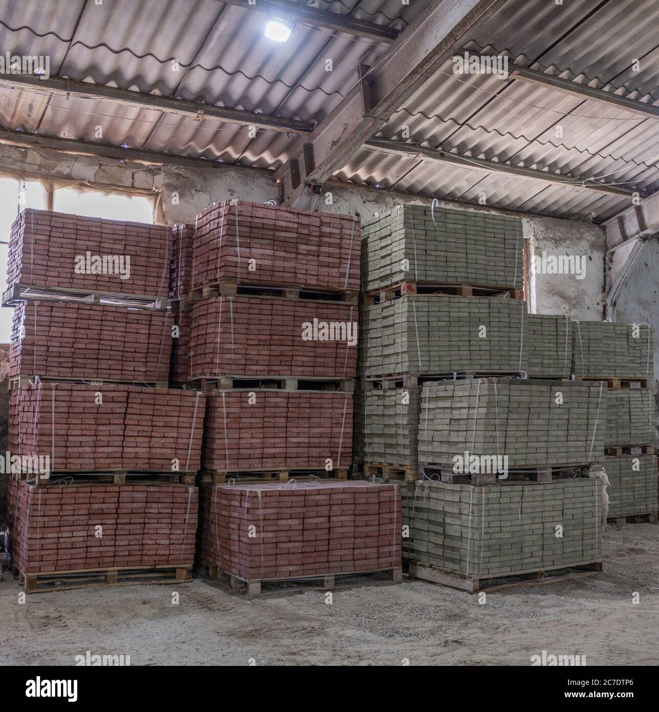Paving slabs. Boxes of paving slabs on wooden pallets. Production of ...