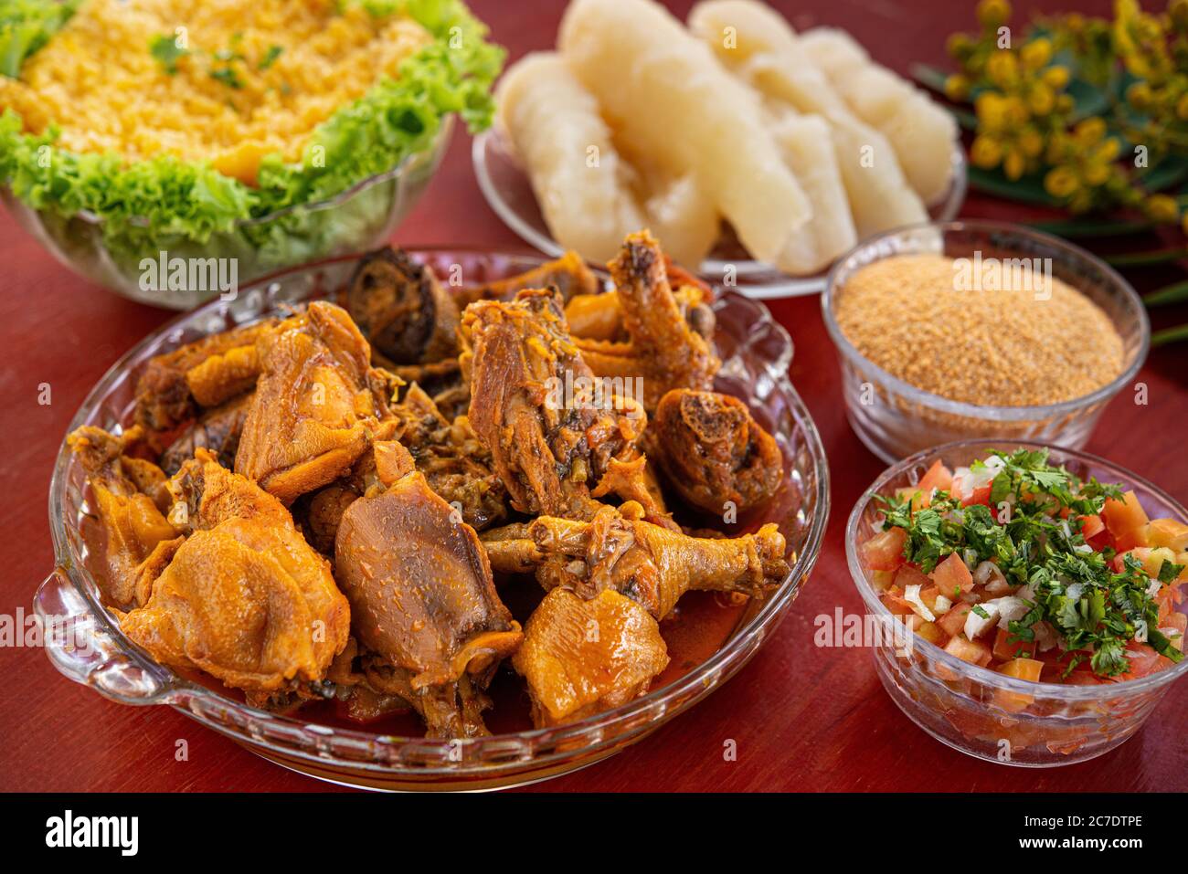 Gastronomy. Hen chicken with rice, manioc, flour and vinaigrette ...