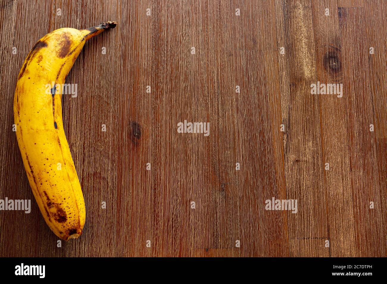 funny banana on brown table Stock Photo - Alamy