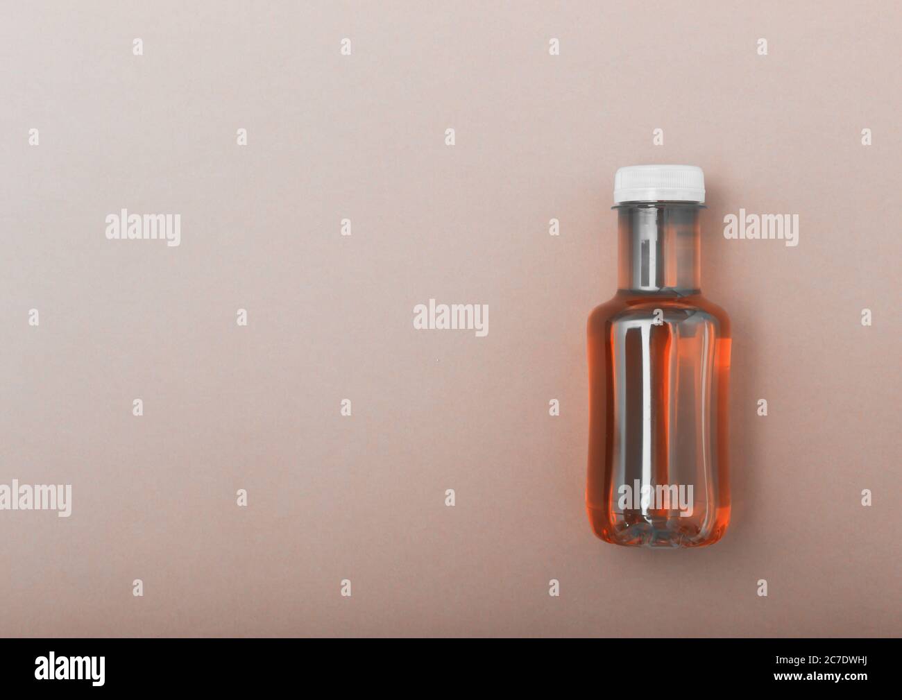 Bottle of ice tea, top view beige background Stock Photo - Alamy