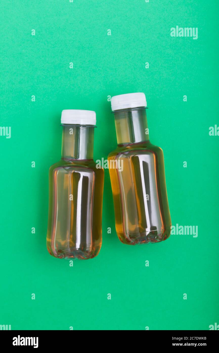 Bottles of ice tea, top view with green background Stock Photo - Alamy