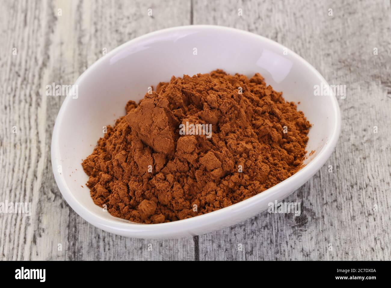 Cocoa powder in the bowl - ready for cooking Stock Photo - Alamy