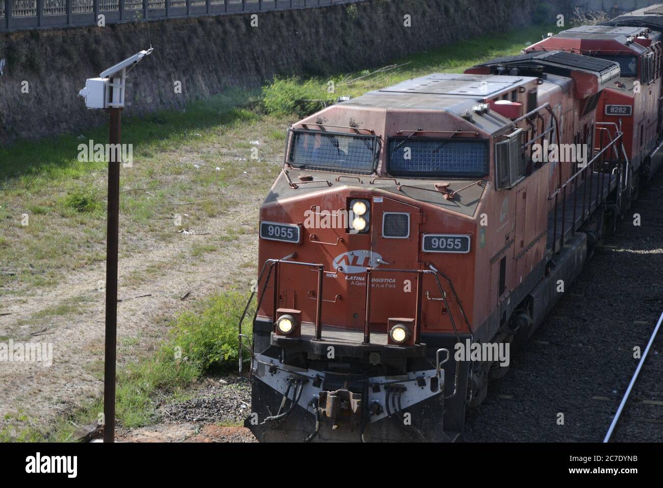 Locomotive with front view, with freight cars in the interior of Brazil ...