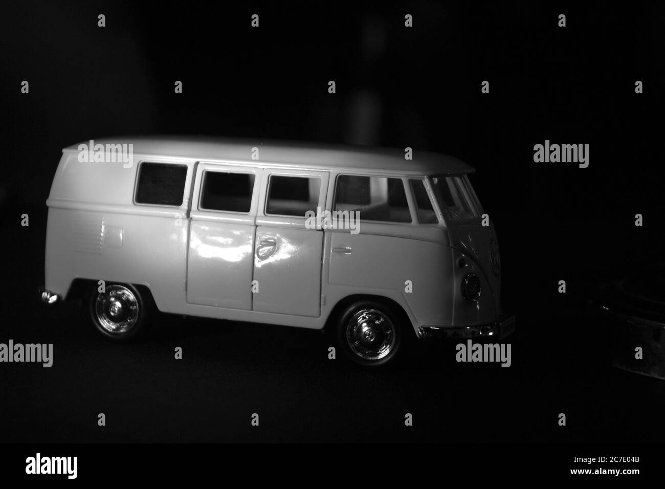 Minivan steel minivan. Vintage white car, in side view with doors and ...