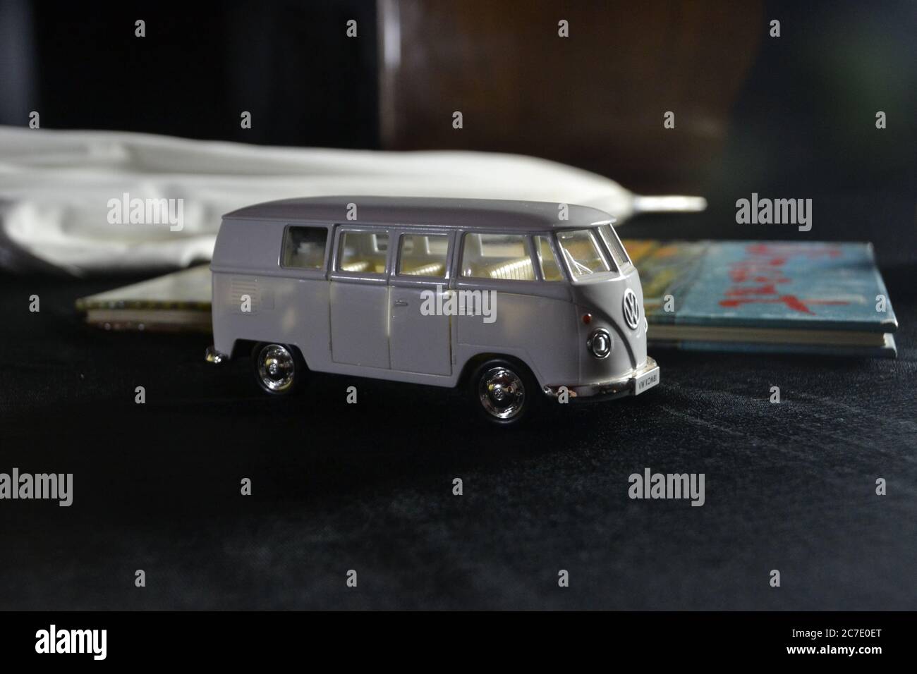 Minivan iron. White minivan model, vintage in miniature, with blurred ...