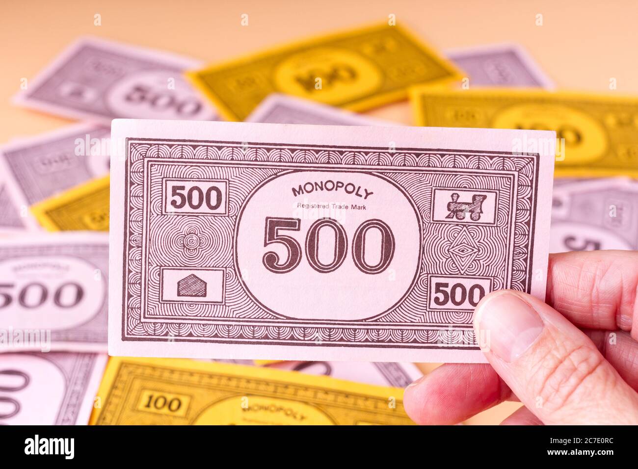 Holding a monopoly 500 note Stock Photo - Alamy
