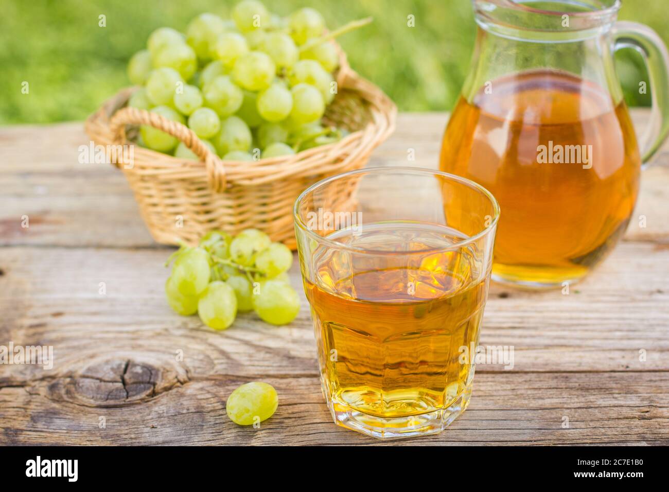 Grape juice in the glass and pitcher Stock Photo - Alamy