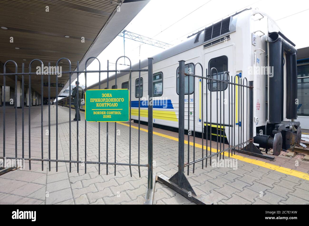 Plate with a sign Border Control Zone hanging on a fence, train, border ...